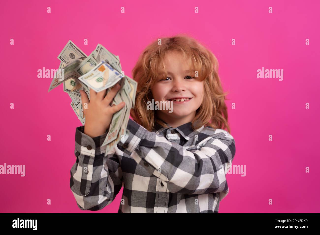 American dreams. Child showing money dollar bills, standing dreamy of ...