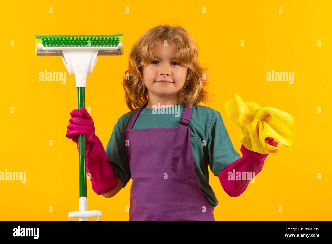 Little kid cleaning at home. Child doing housework having fun. Studio ...