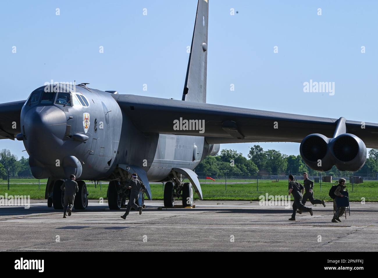 Aircrew assigned to the 5th Bomb Wing prepares to board a B-52H ...