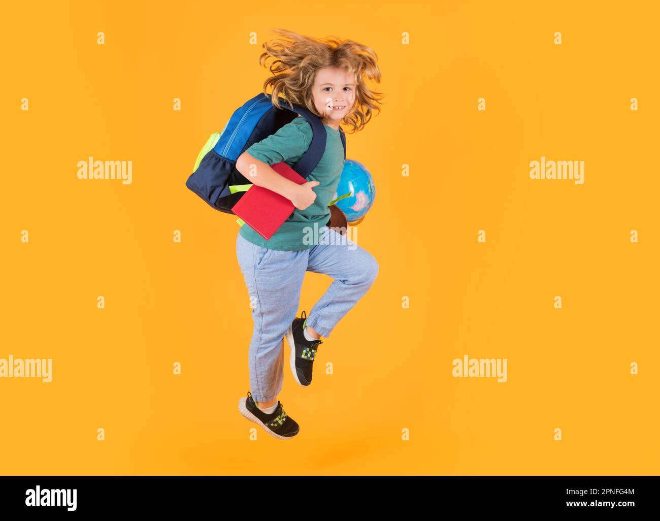 Full length body of cheerful school child jumping running back to ...