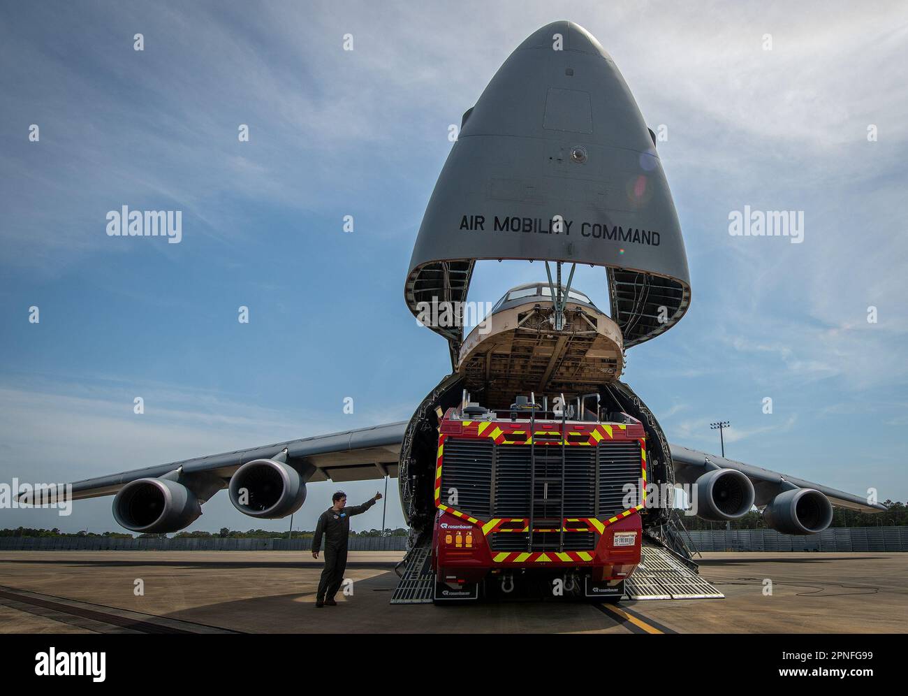 A P-23 fire truck rolls into the mouth of a C-5M Super Galaxy to be ...