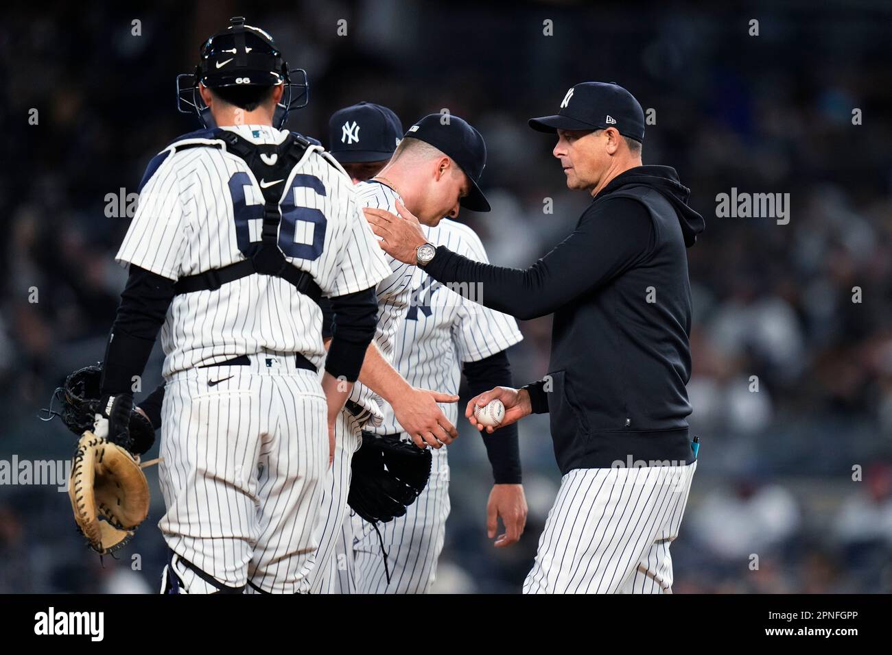 New York Yankees relief pitcher Clay Holmes hands the ball to manager ...