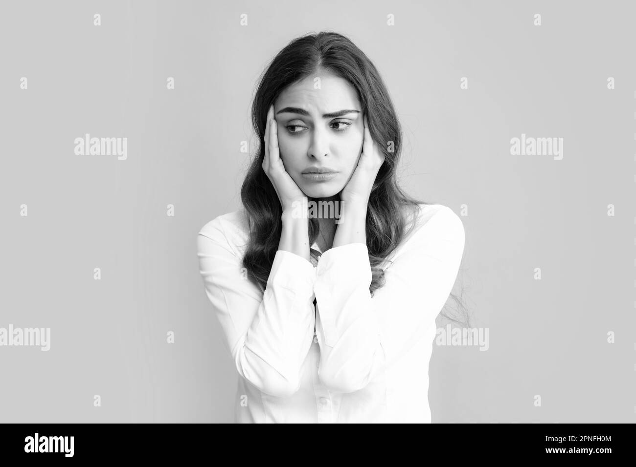Portrait of young woman feeling stress or strain headache. Exhausted ...