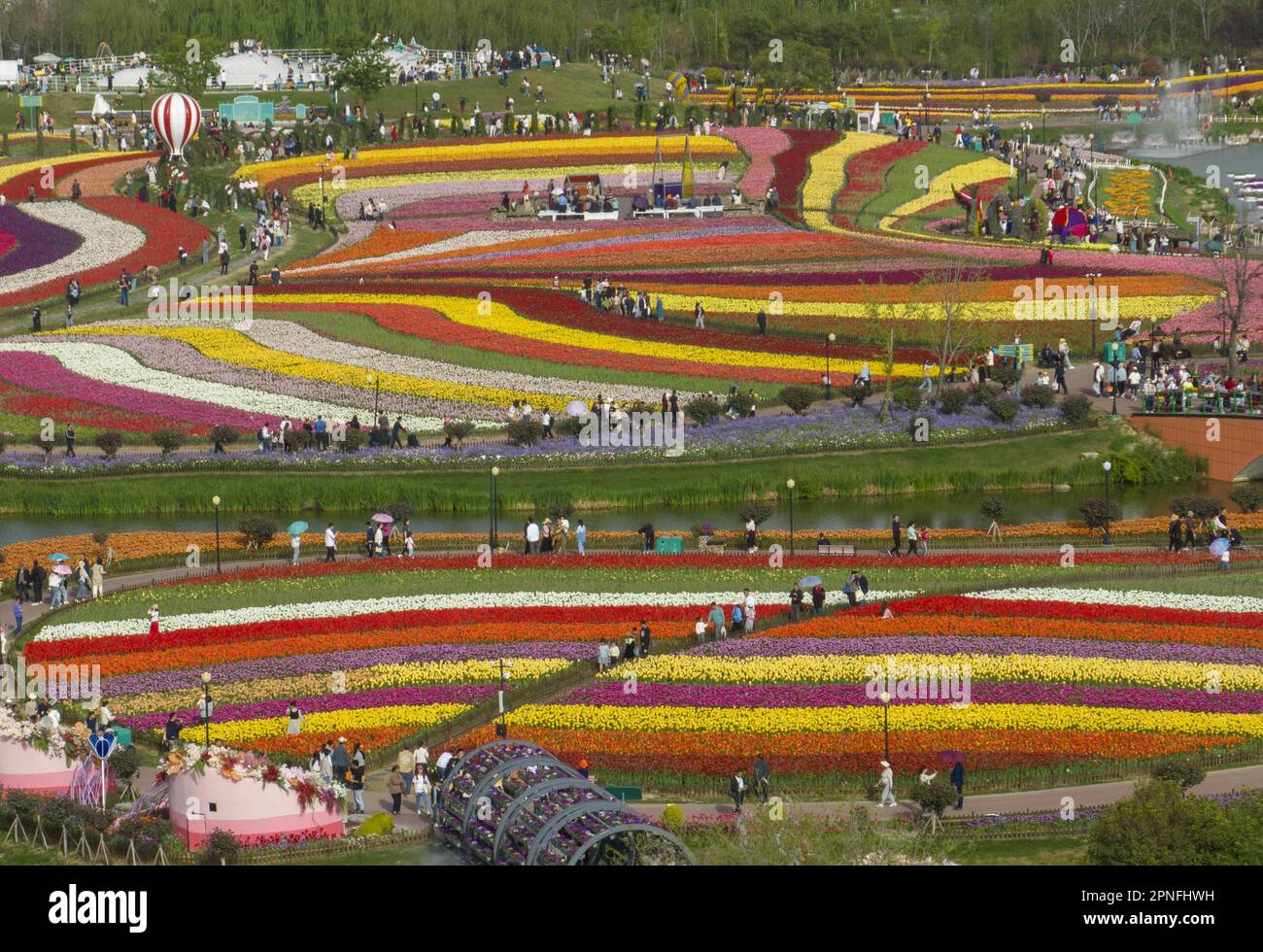 Aerial photo shows tourists visiting the Holland Flower Park in Dafeng ...