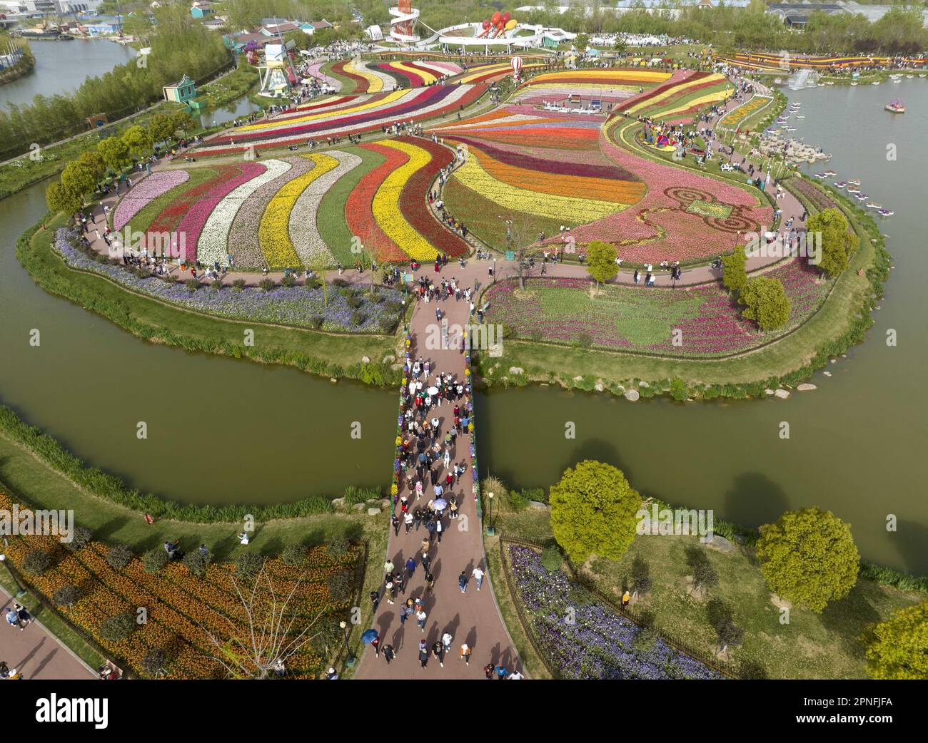 Aerial photo shows tourists visiting the Holland Flower Park in Dafeng ...