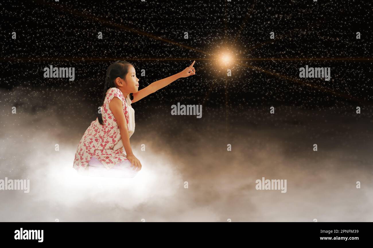 A girl reaching for the star, sitting on a cloud in dark sky, night ...