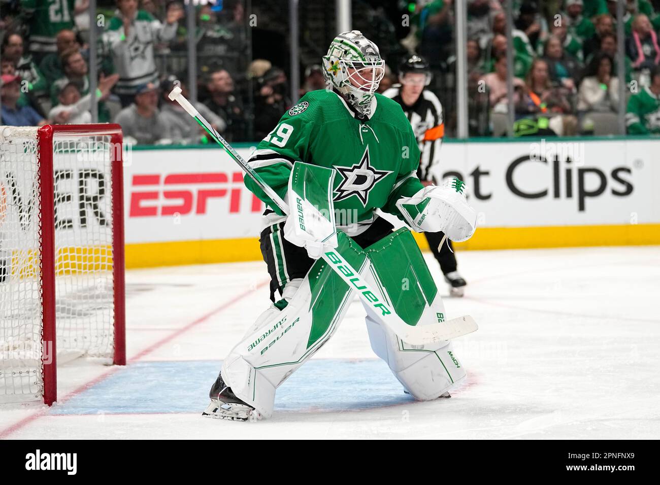 Dallas Stars goaltender Jake Oettinger minds the net during a face-off ...