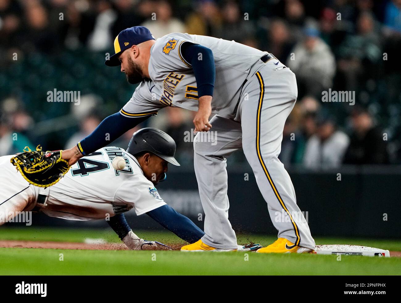 Milwaukee Brewers first baseman Rowdy Tellez loses the ball in a ...