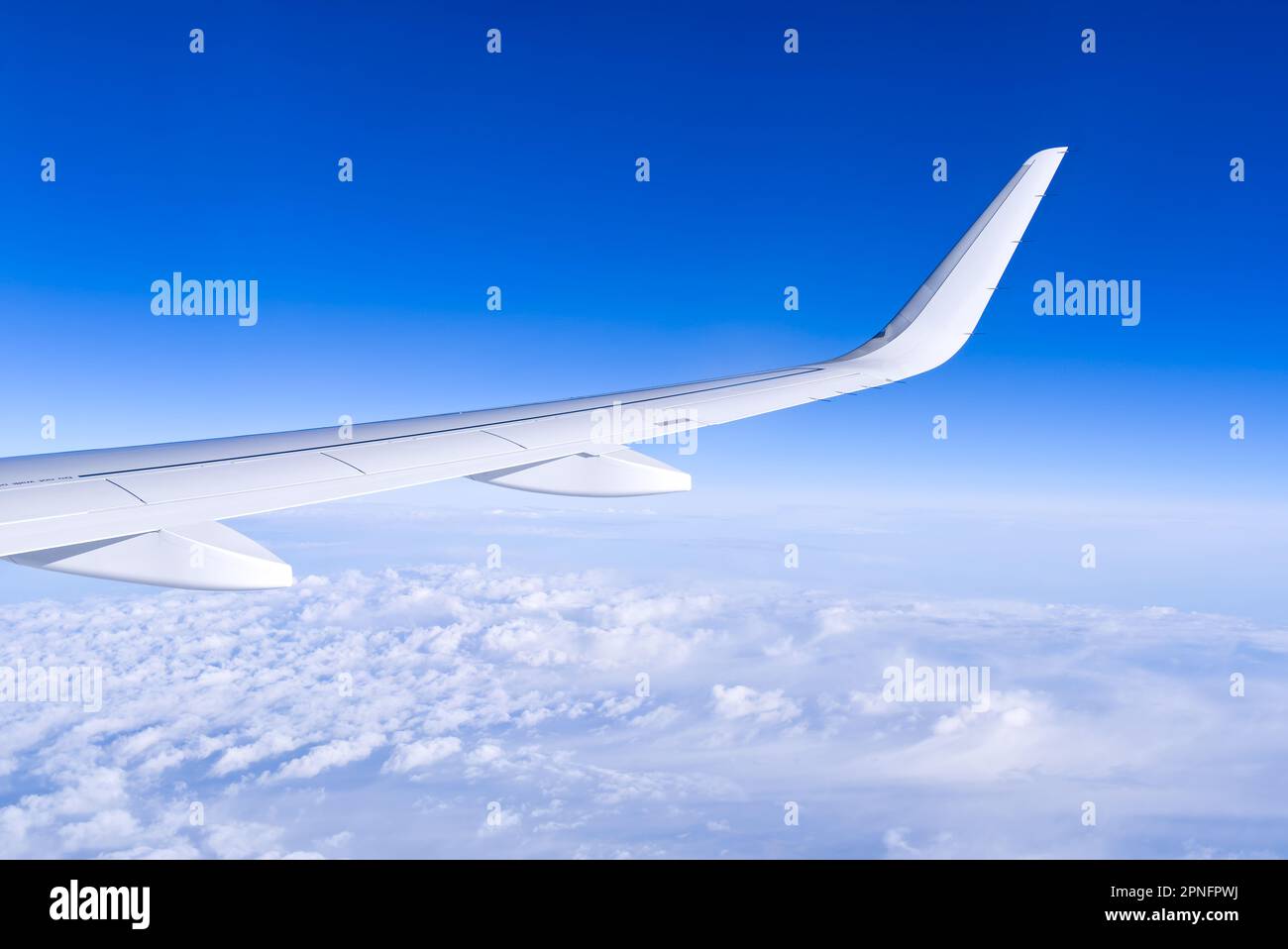 Airplain wing view thrue window in the sky. Clouds sky, airplane's wing ...