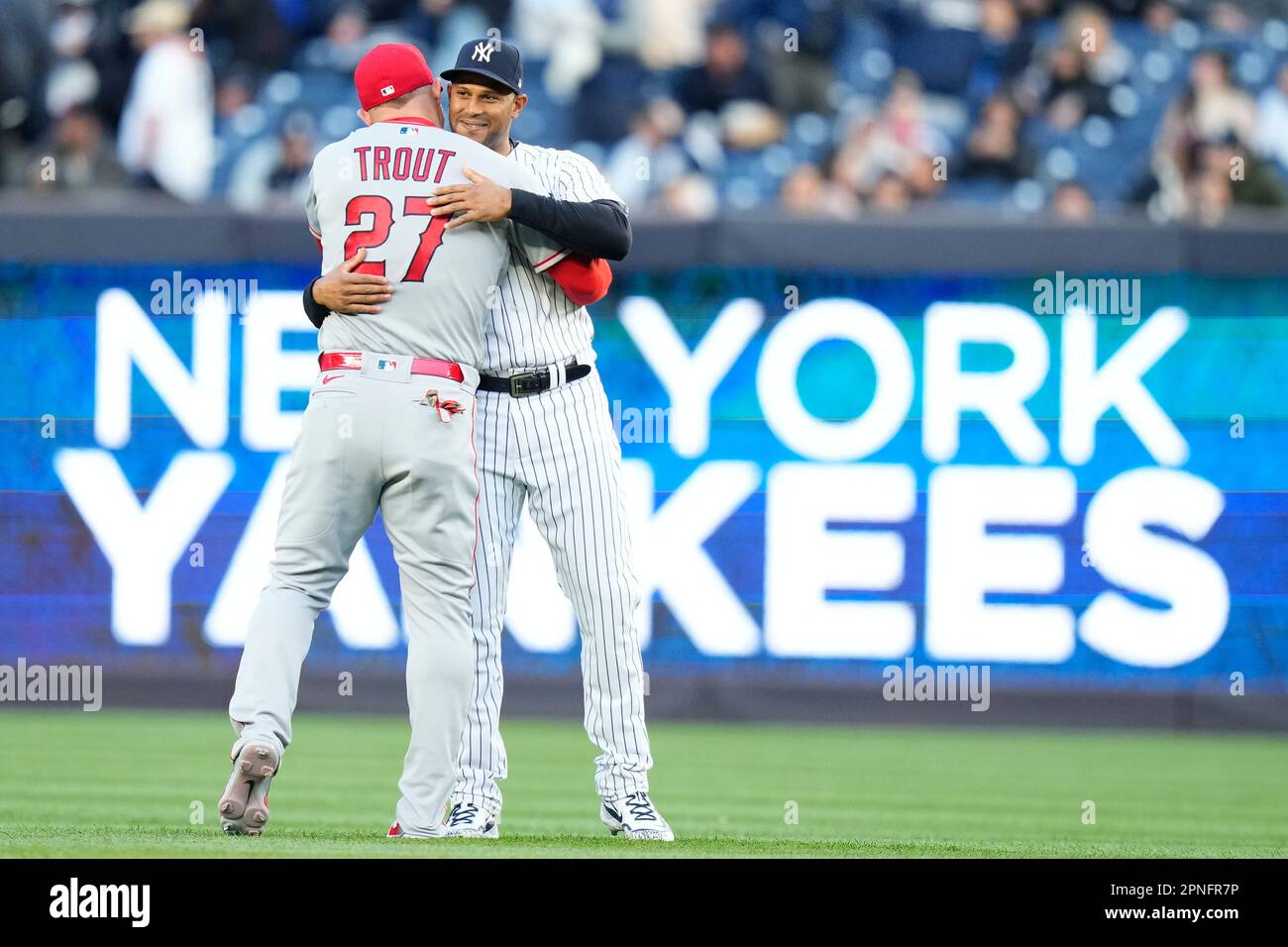 New York Yankees' Aaron Hicks, right, hugs Los Angeles Angels' Mike ...