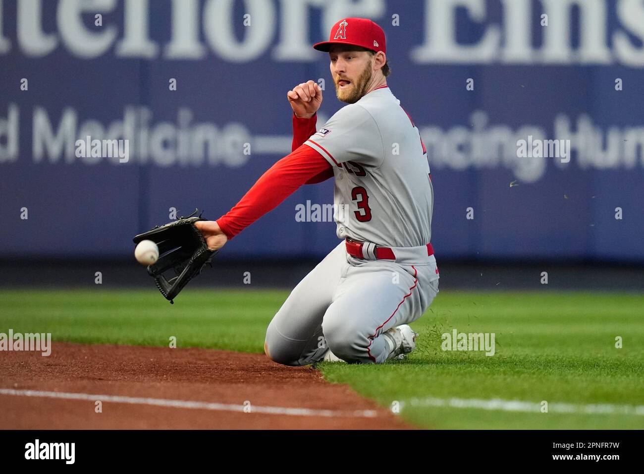 Los Angeles Angels left fielder Taylor Ward (3) dives for a ball hit by ... Los Angeles Angels left fielder Taylor Ward (3) dives for a ball hit by ...