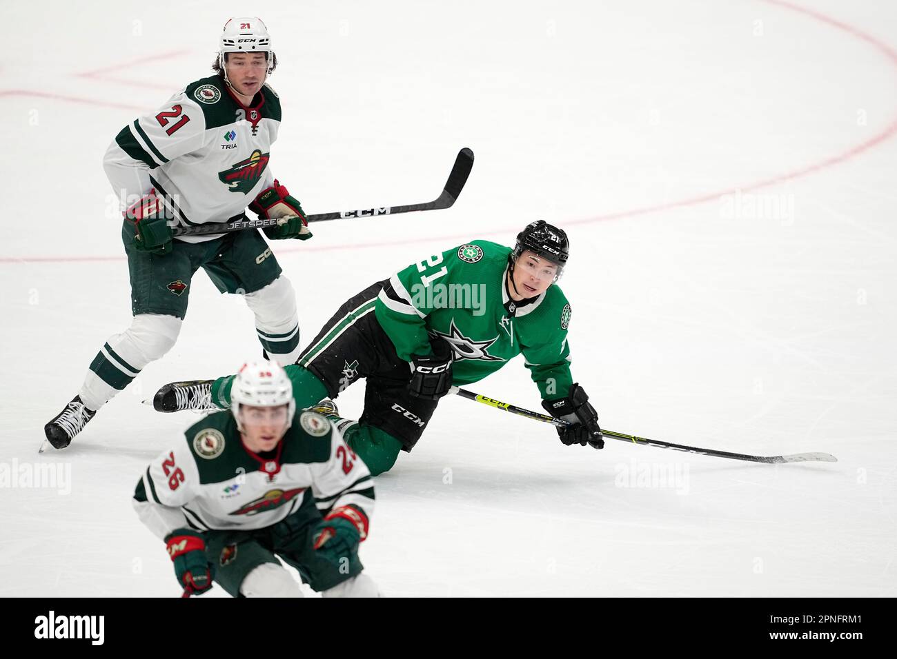 Dallas Stars' Jason Robertson (21) falls to the ice working against ...