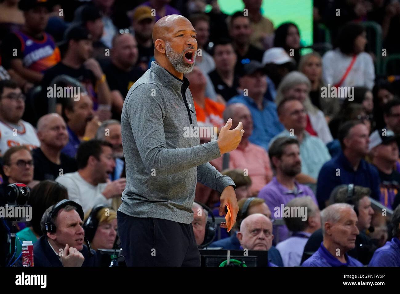Phoenix Suns head coach Monty Williams makes a call during the first half of Game 2 of a first ...