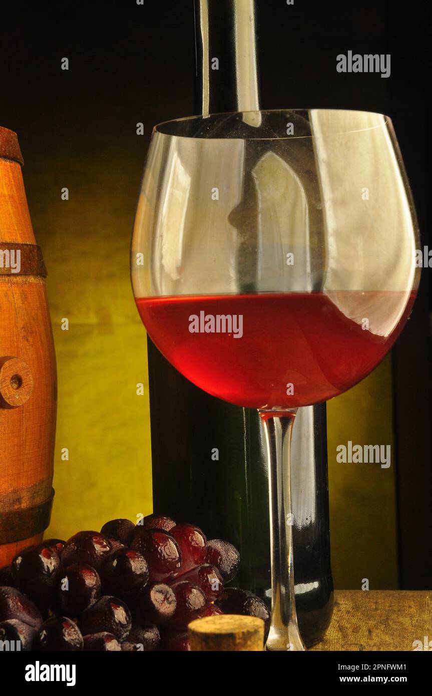 Glass and bottle of wine on the table Stock Photo - Alamy