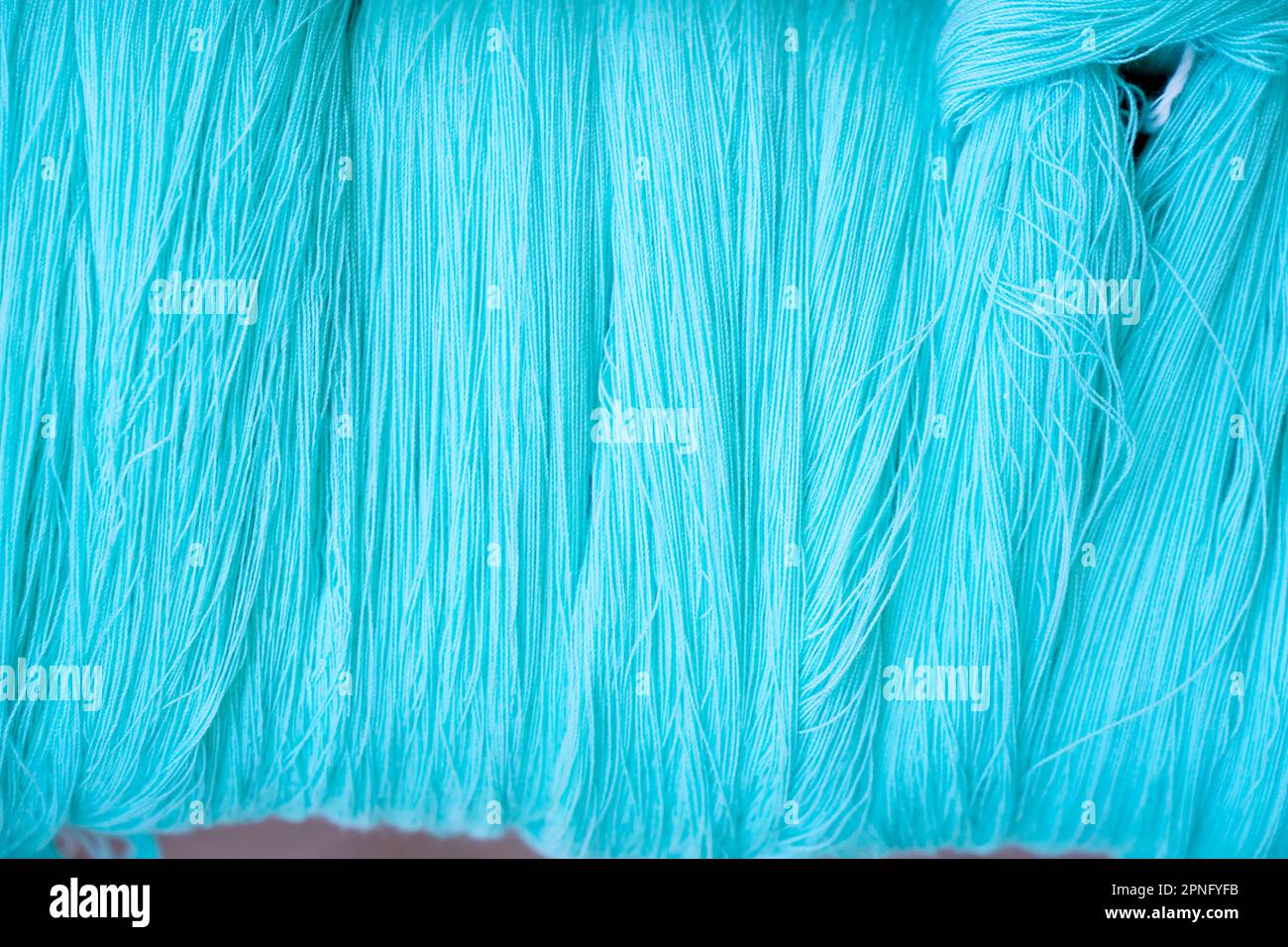 Turquoise color thai silk Yarn Stock Photo - Alamy