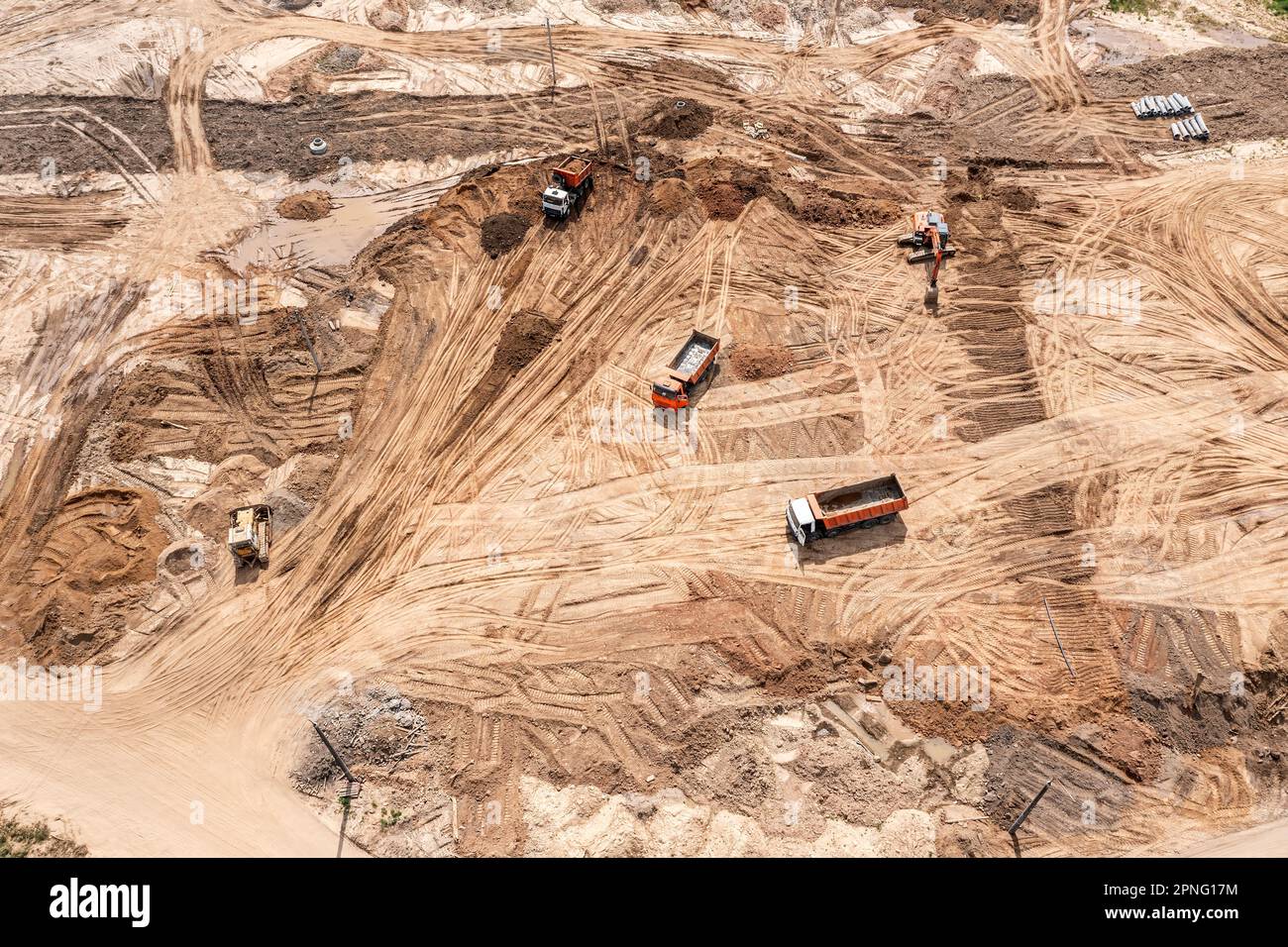 vast earthworks on construction site with multiple heavy industrial ...