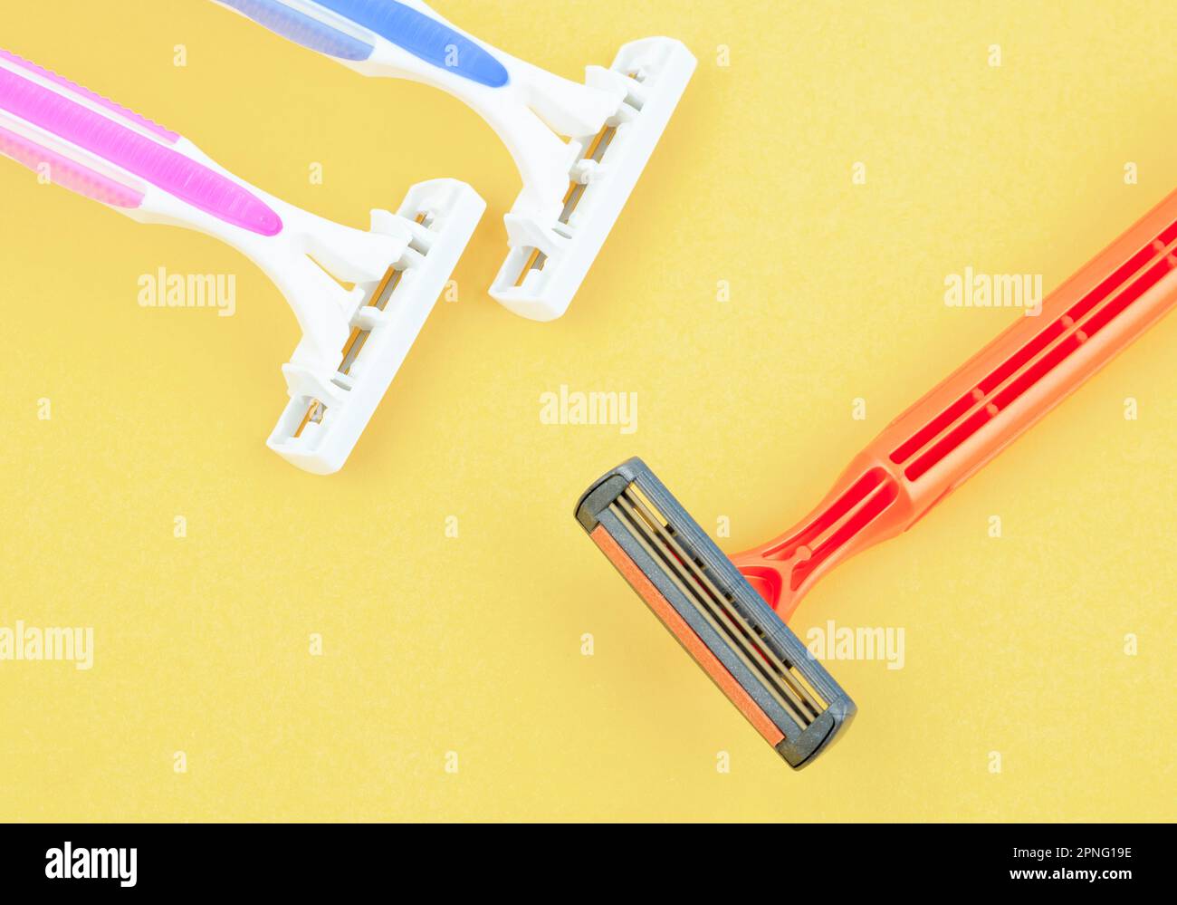 Group of plastic, disposable razors on yellow background Stock Photo ...