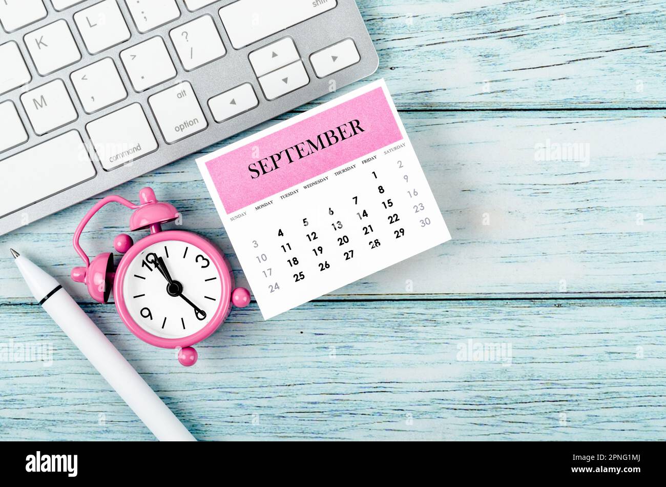 September 2023 Monthly calendar year and alarm clock with keyboard ...