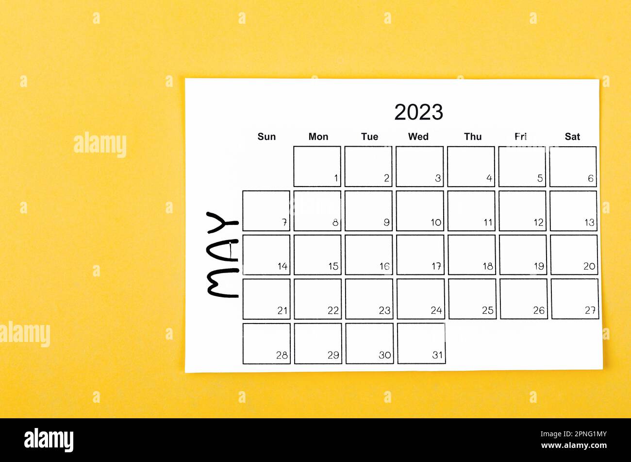 May 2023 monthly calendar sheet on yellow background Stock Photo - Alamy