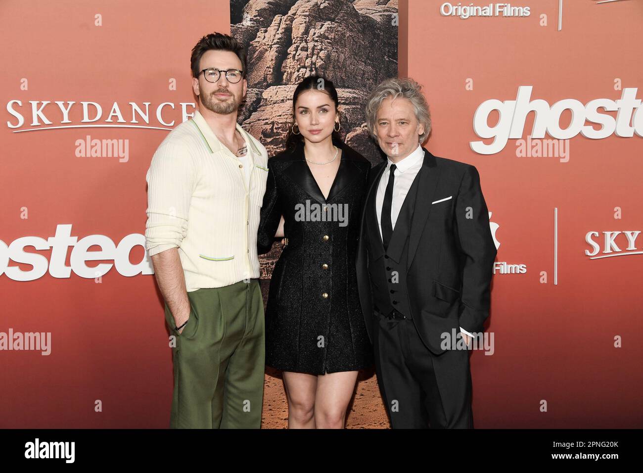 Chris Evans, left, Ana de Armas and Dexter Fletcher attend the premiere ...