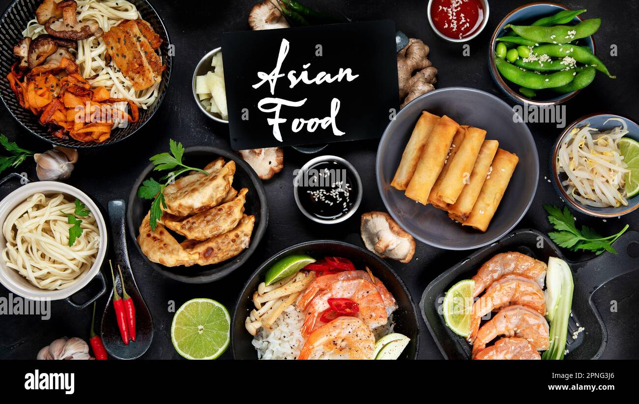 Various asian meals dishes on black background , top view. Asian food ...