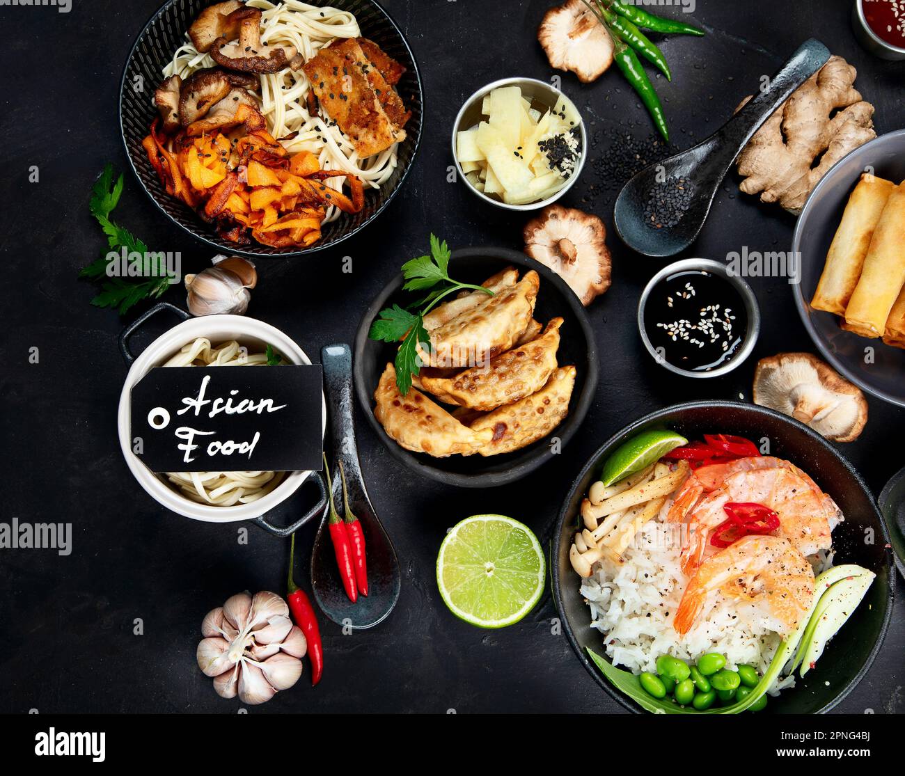 Various asian meals dishes on black background , top view. Asian food ...