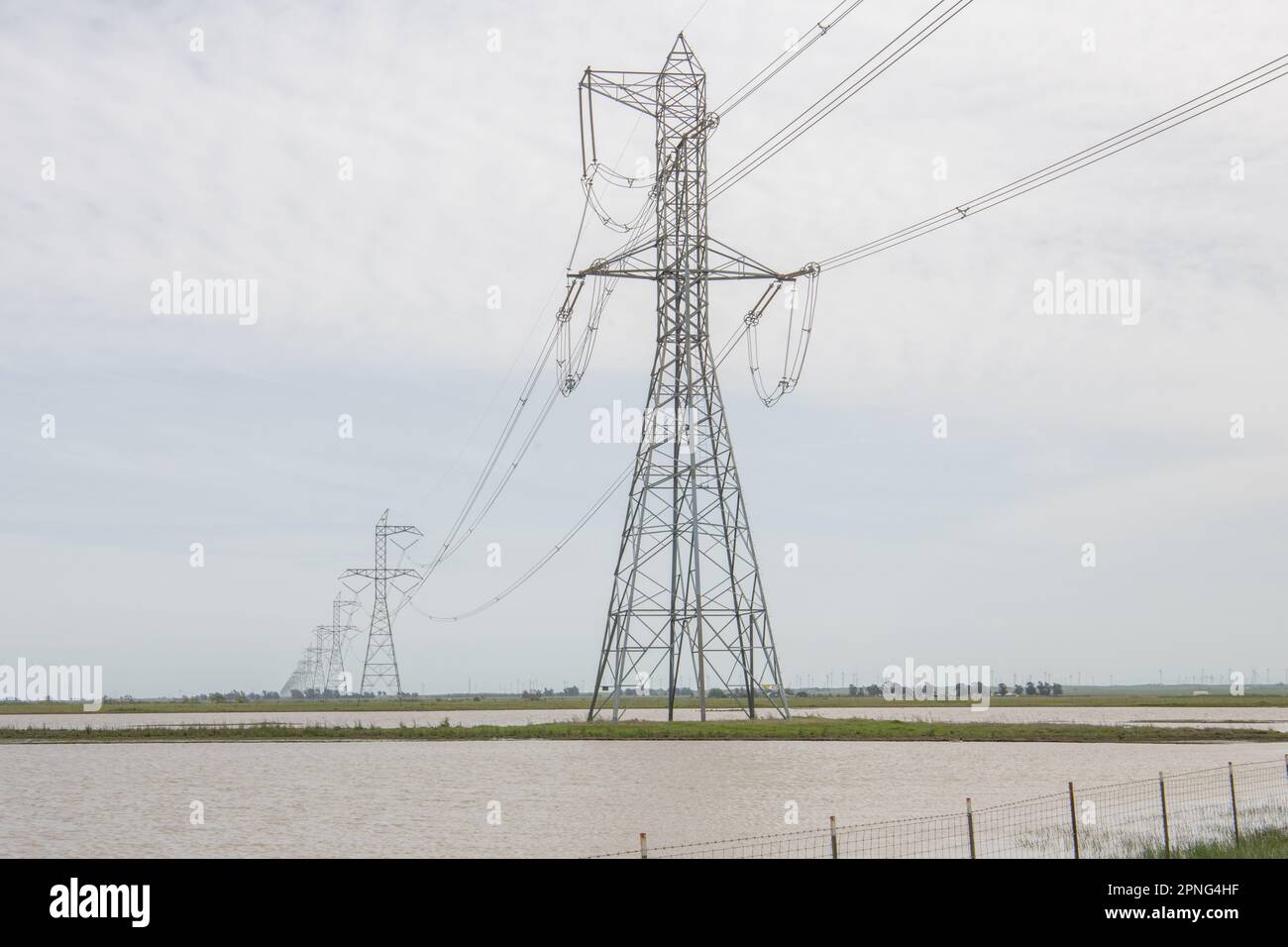 Electrical towers over flooded fields turned to vernal pools in the ...