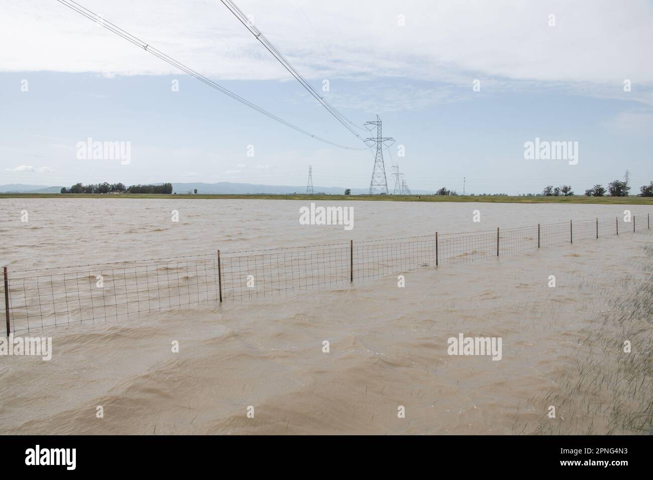 Electrical towers over flooded fields turned to vernal pools in the ...