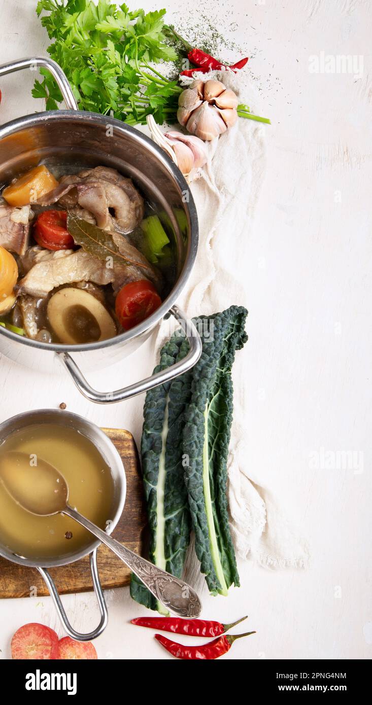 Beef broth of beef meat on bones slow cooked with vegetables: carrot ...