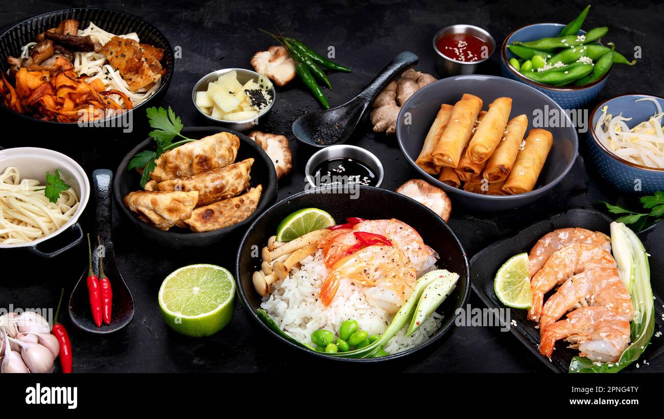 Various asian meals dishes on black background. Asian food concept ...