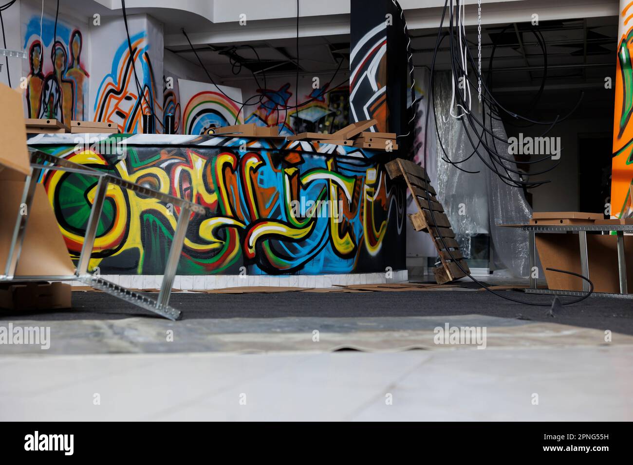 Artistic drawings on walls in old abandoned building looking neglected ...