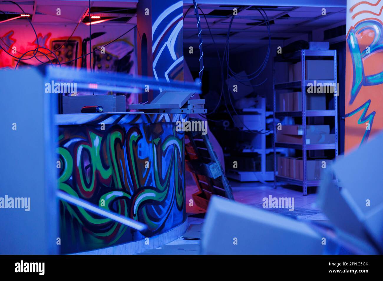 Chaotic illuminated empty space with dirty structure glowing with ...