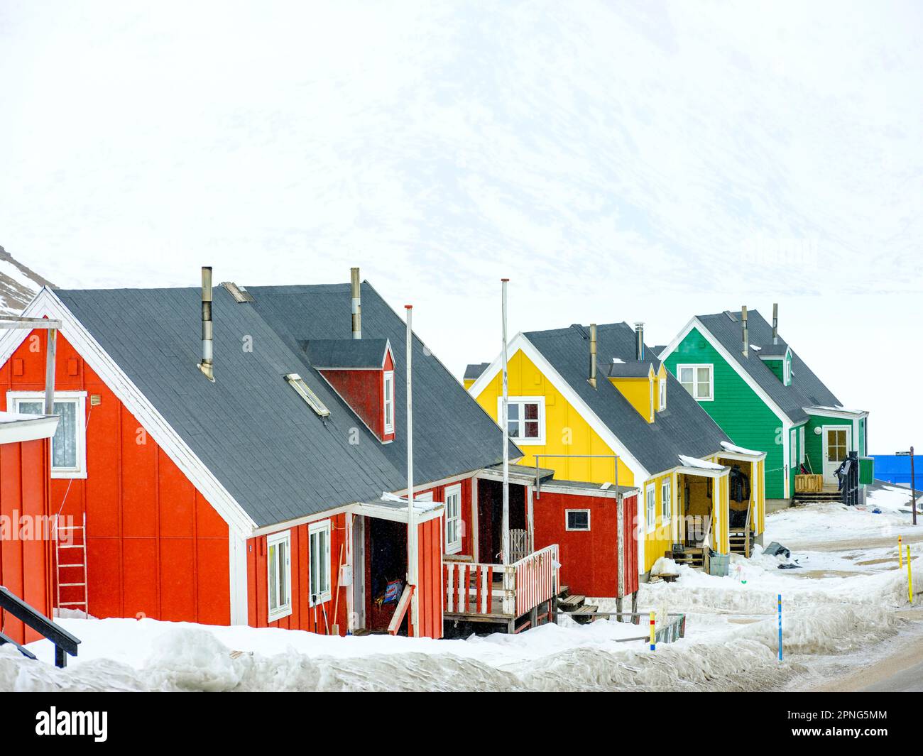 Colourful wooden houses in Tasiilaq in winter, Ammassalik Island ...