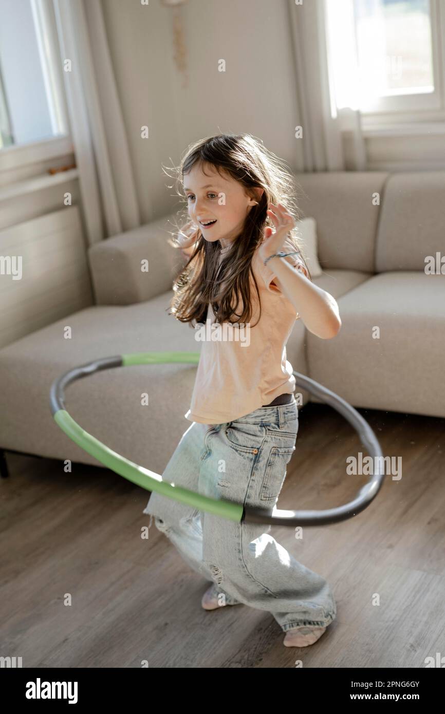 Girl gymnastics with hula hoop Stock Photo - Alamy