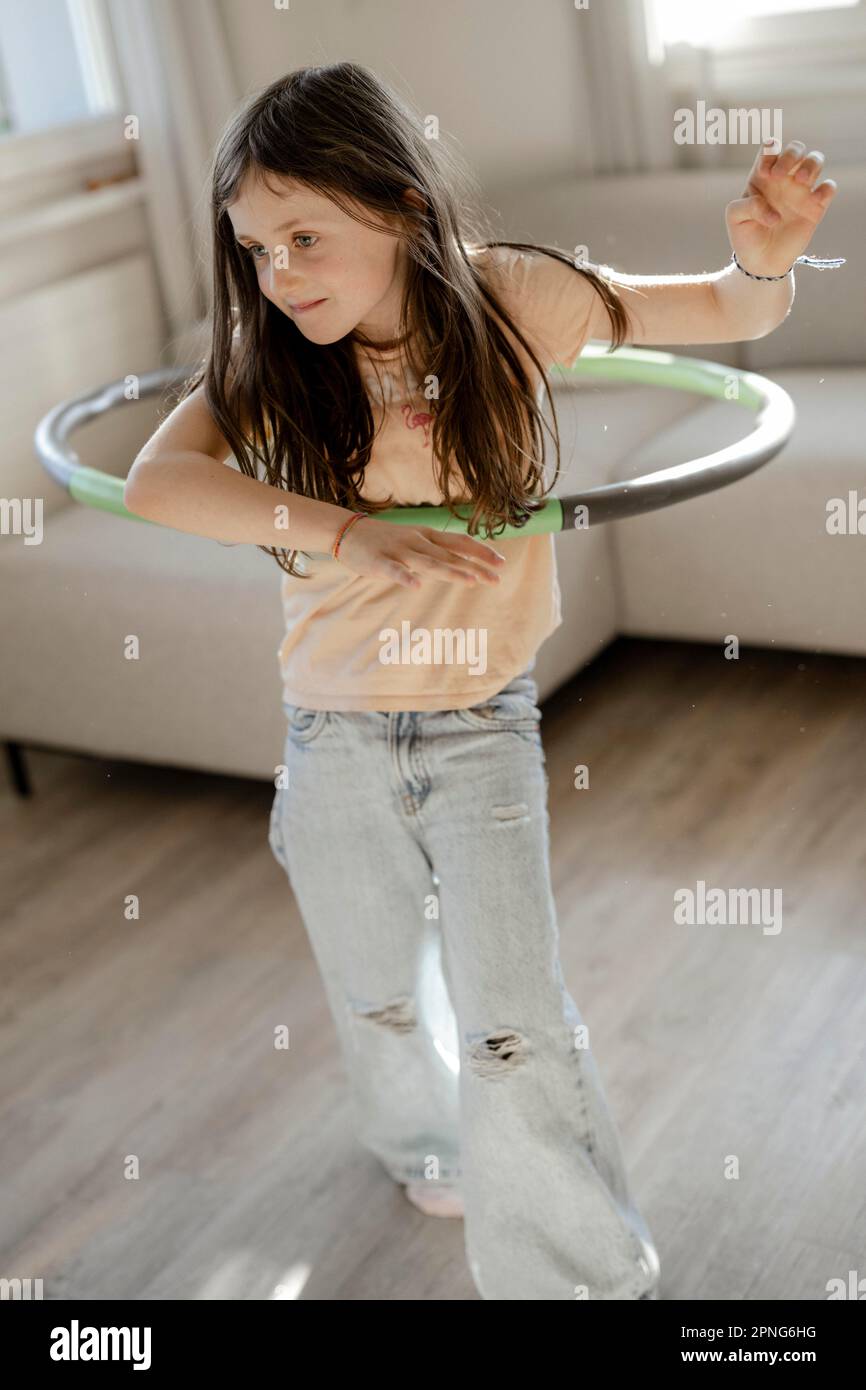 Girl gymnastics with hula hoop Stock Photo - Alamy