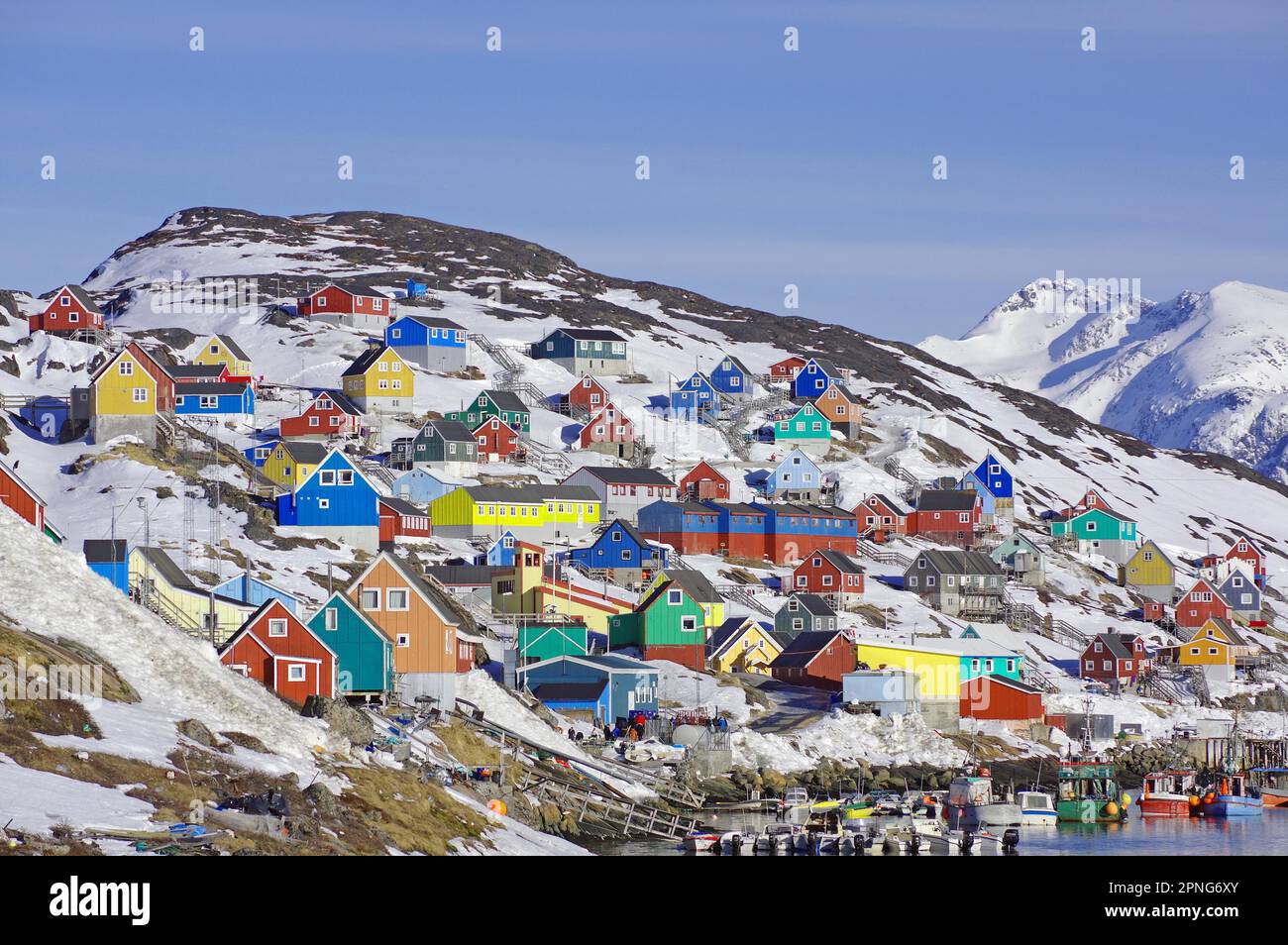Wooden houses in different colours in winter landscape, Arctic ...