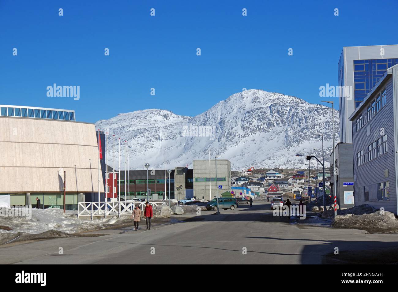 Main street with shops and tall buildings in the Greenlandic capital ...