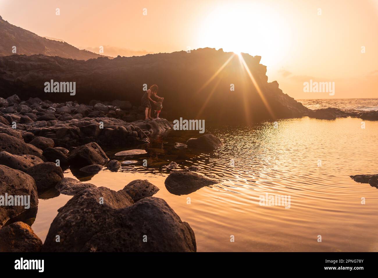 El Hierro Island. Canary Islands, a family enjoying the natural pool of ...