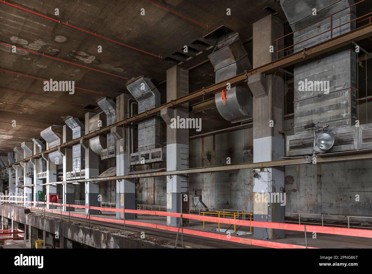 Security barrier in the empty production halls of a former paper ...