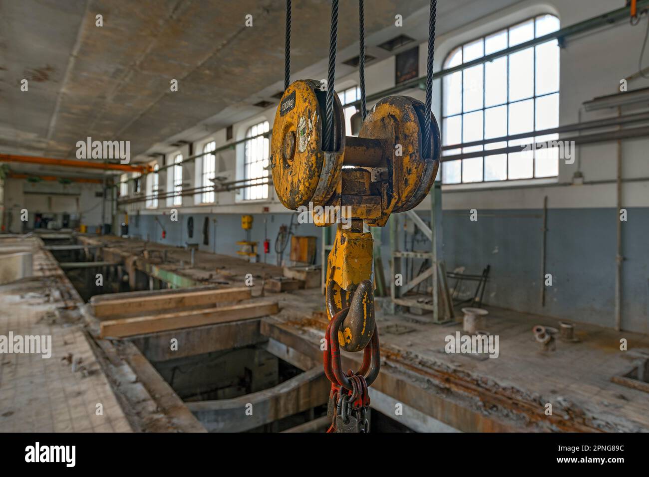 Hooks for heavy loads in a former paper factory, Lost Place, Baden ...
