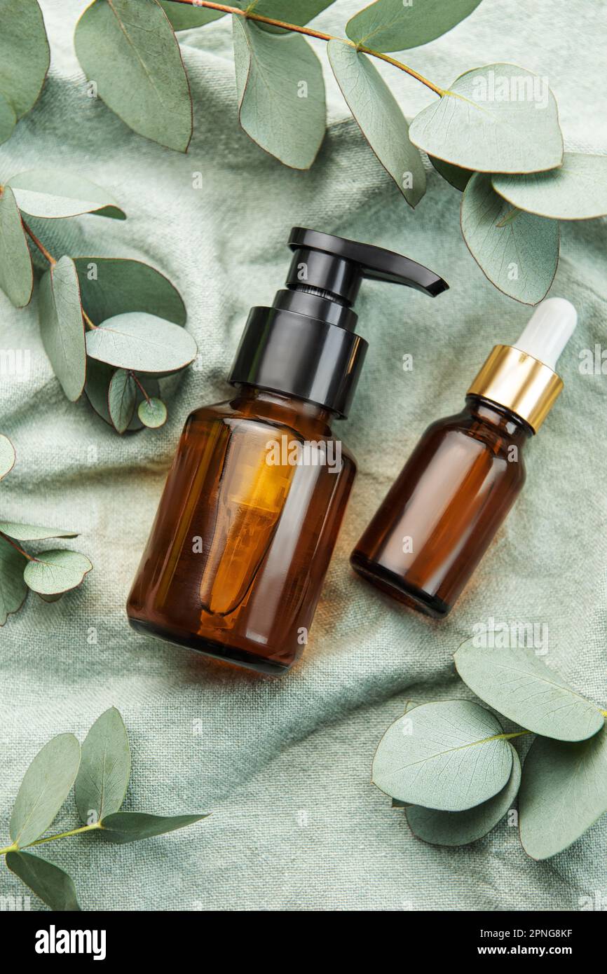 Massage and Spa products with eucalyptus on a textile fabric background ...