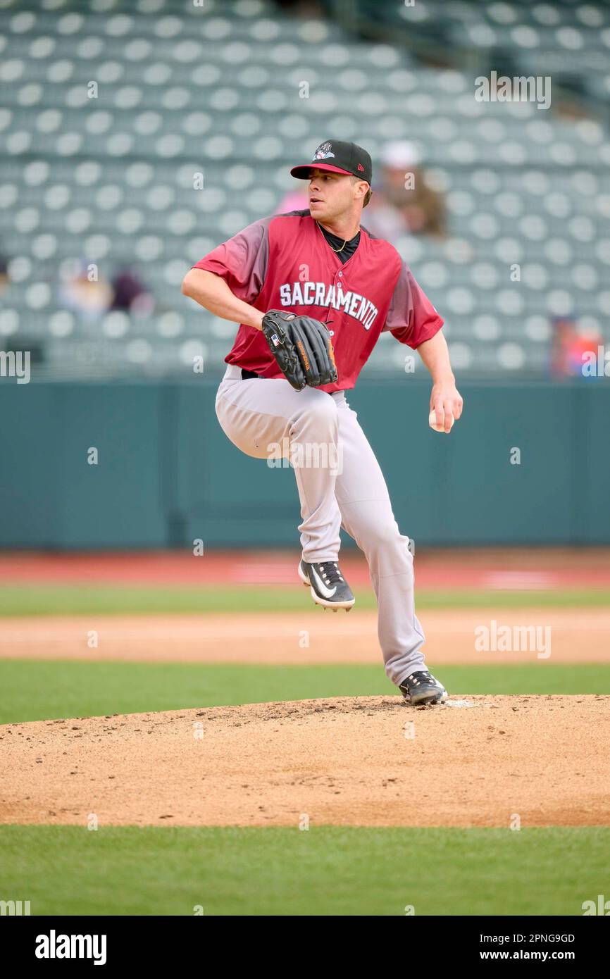 Relief pitcher Sam Long (17) of the Sacramento River Cats delivers a ...