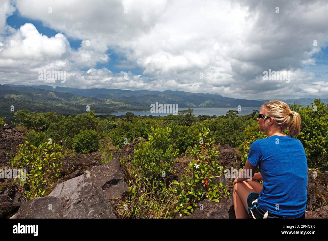 Woman looking at Lake Arenal, Guanacaste and Alajuela provinces, Costa ...