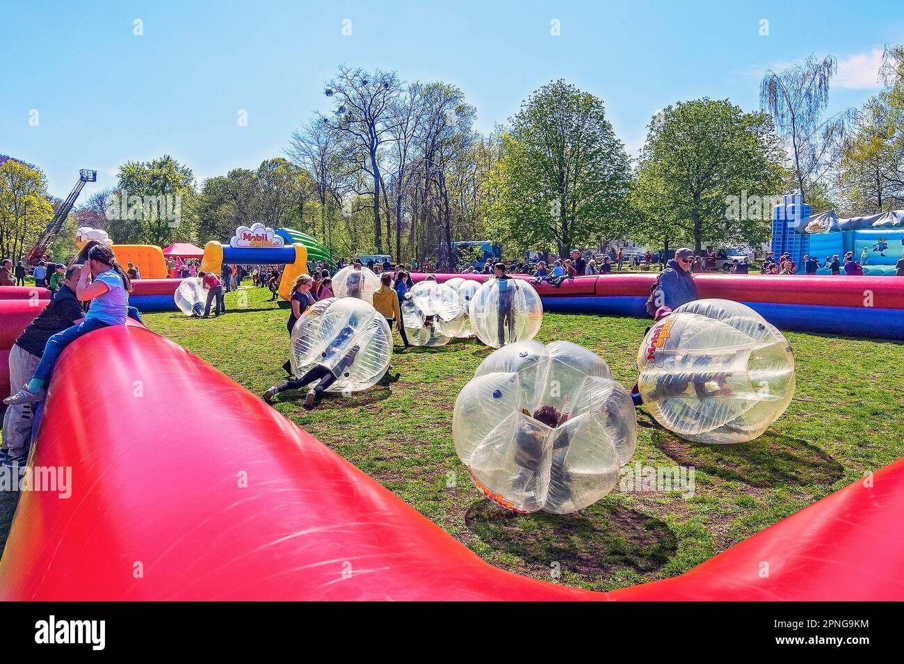 Children playing with inflatable plastic balls in springtime Luitpold ...