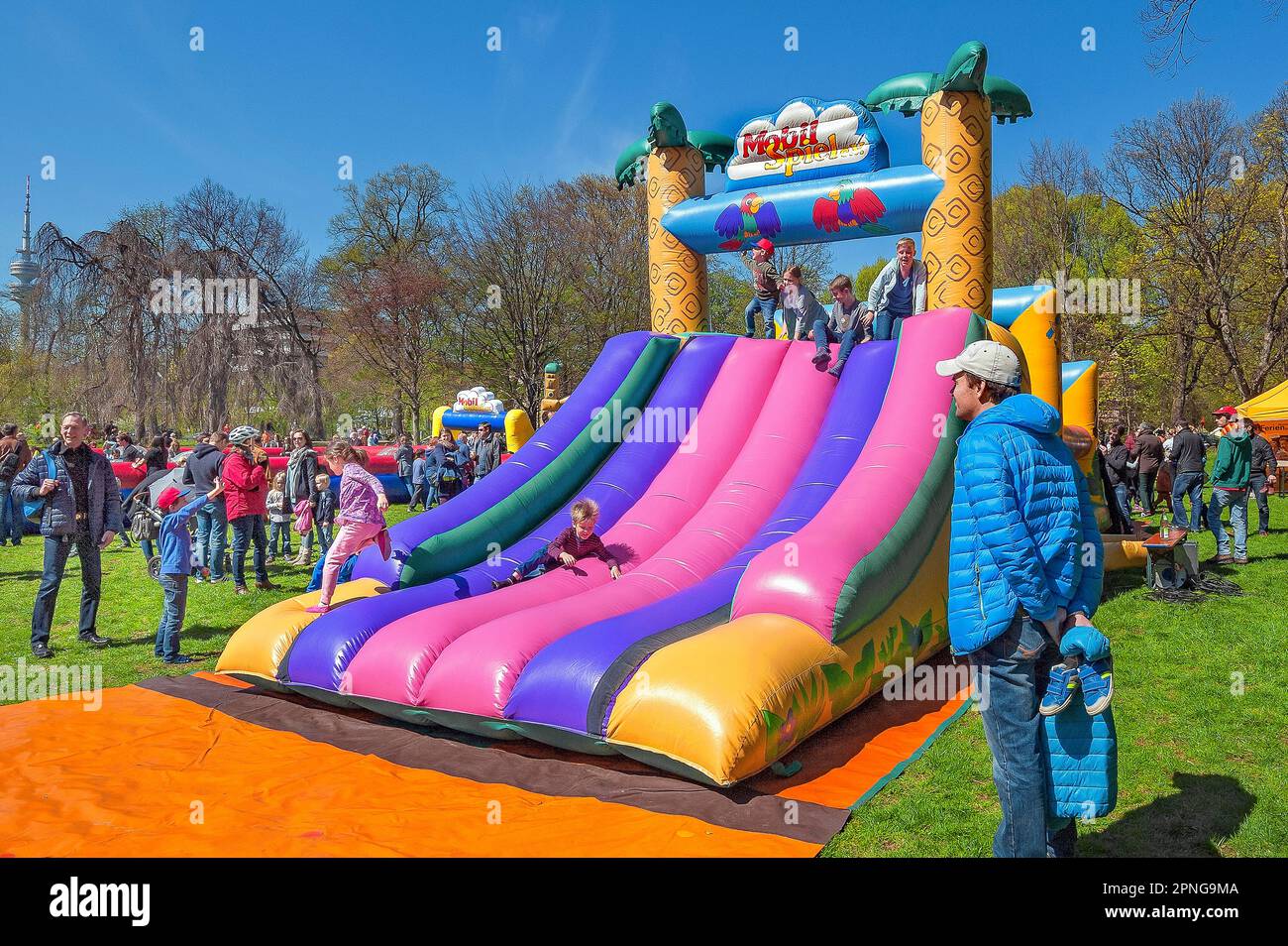Inflatable plastic slide in springtime Luitpoldpark, Munich, Bavaria ...