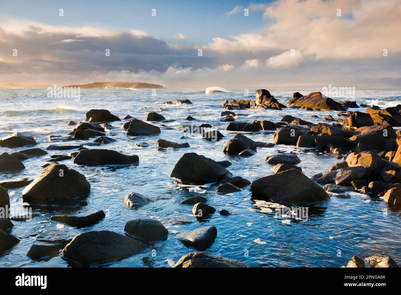 Atmospheric coastal landscape at sunrise on a rocky beach near Reiff on ...