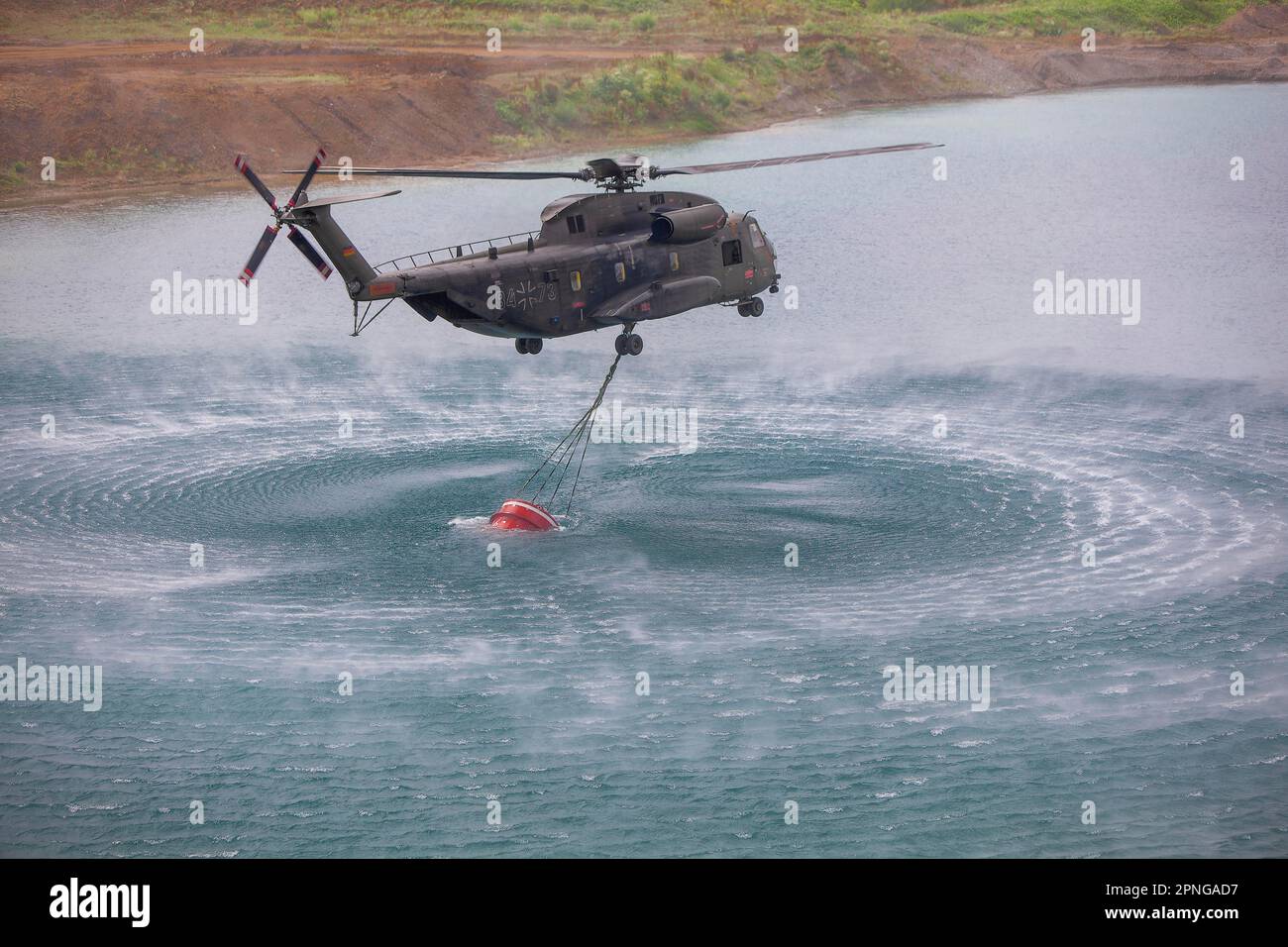 Bundeswehr helicopter with fire extinguishing tank 5000 litres, during ...