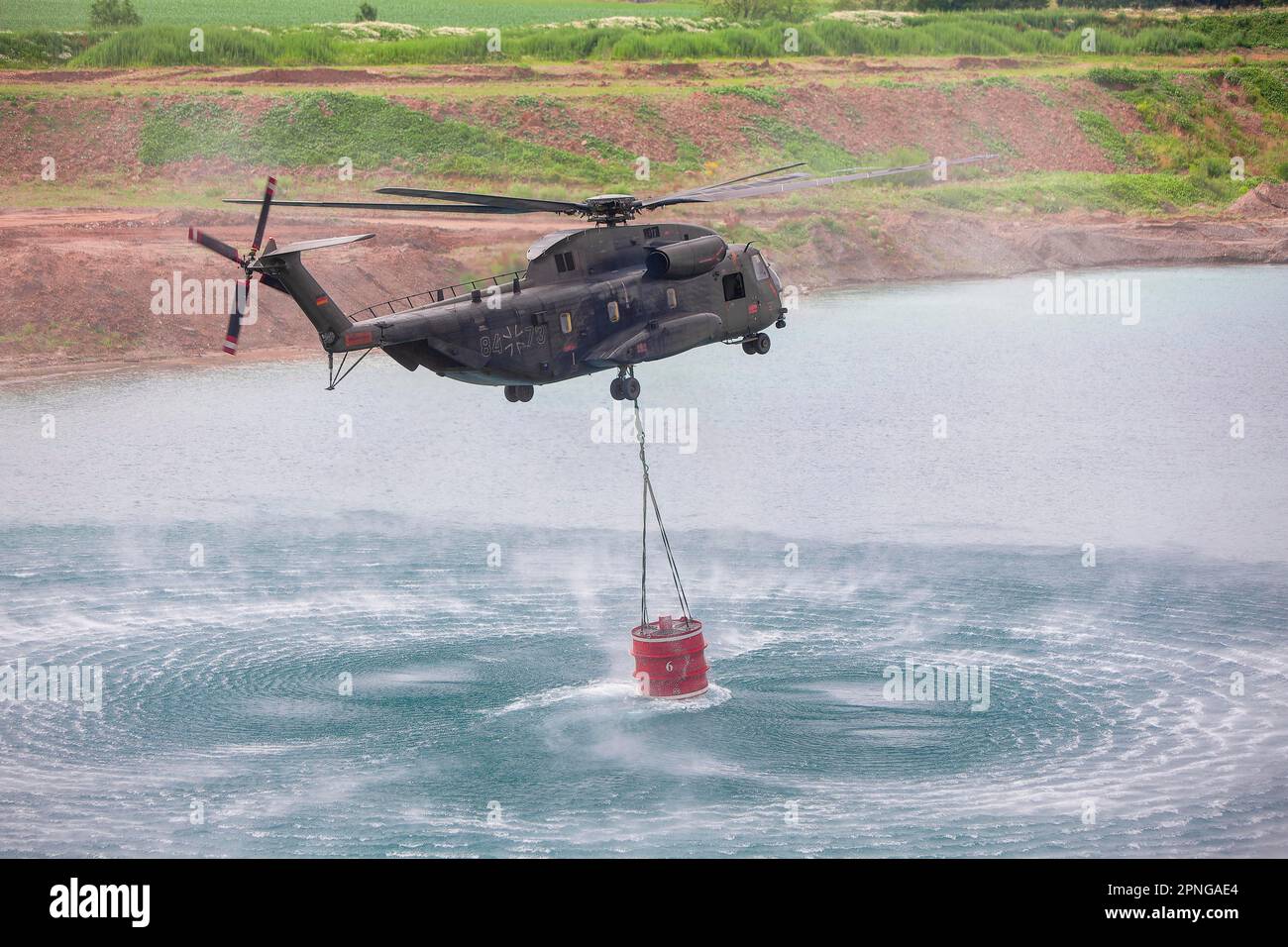 Bundeswehr helicopter with fire extinguishing tank 5000 litres, during ...