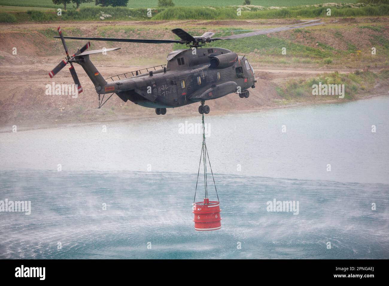 Bundeswehr helicopter with fire extinguishing tank 5000 litres, during ...