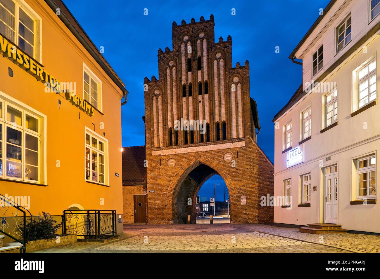 Wassertor, harbour gate in brick Gothic style in the evening, Hanseatic ...